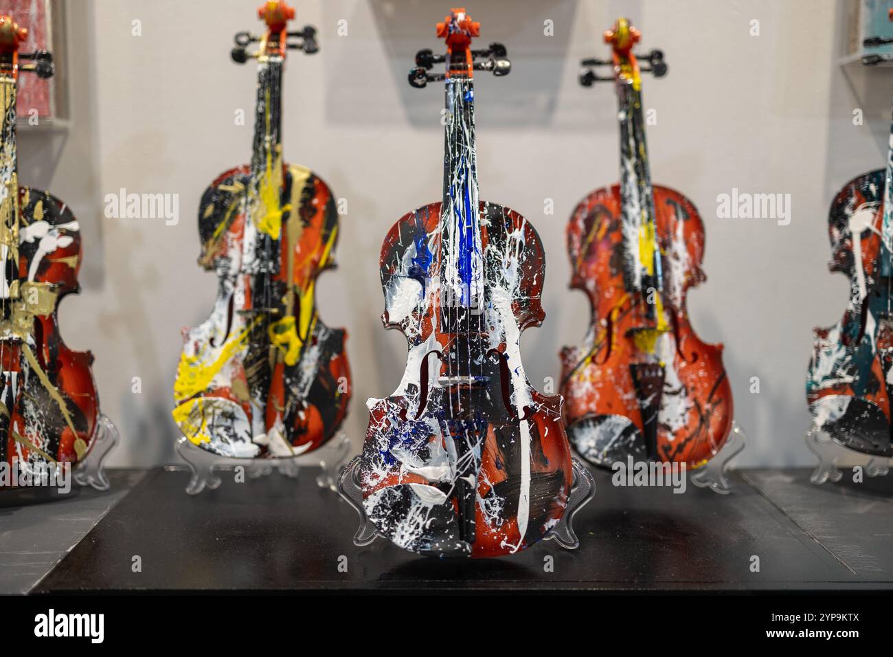 Hand-Painted Colorful Violins in a Modern Art Installation Stock Photo ...