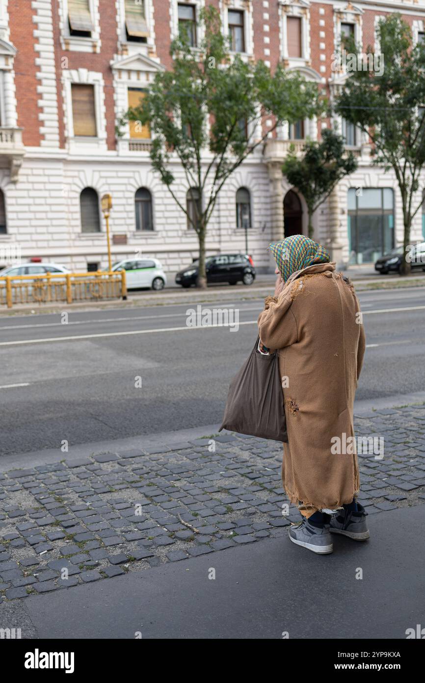 In tattered clothing hi-res stock photography and images - Alamy