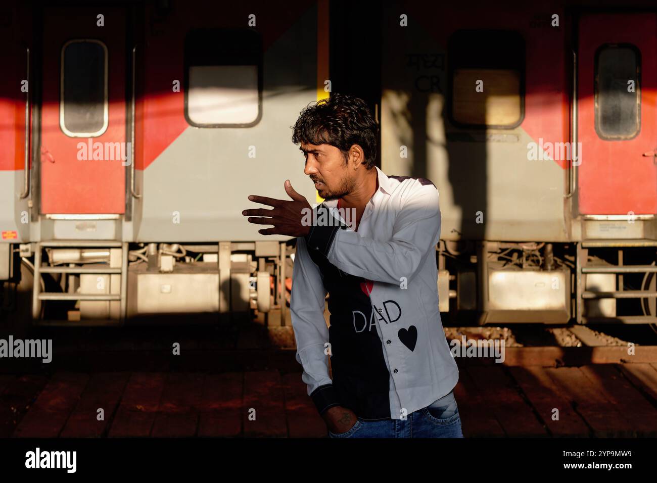 A young Indian male at Dadar Railway Station in Mumbai, India ...
