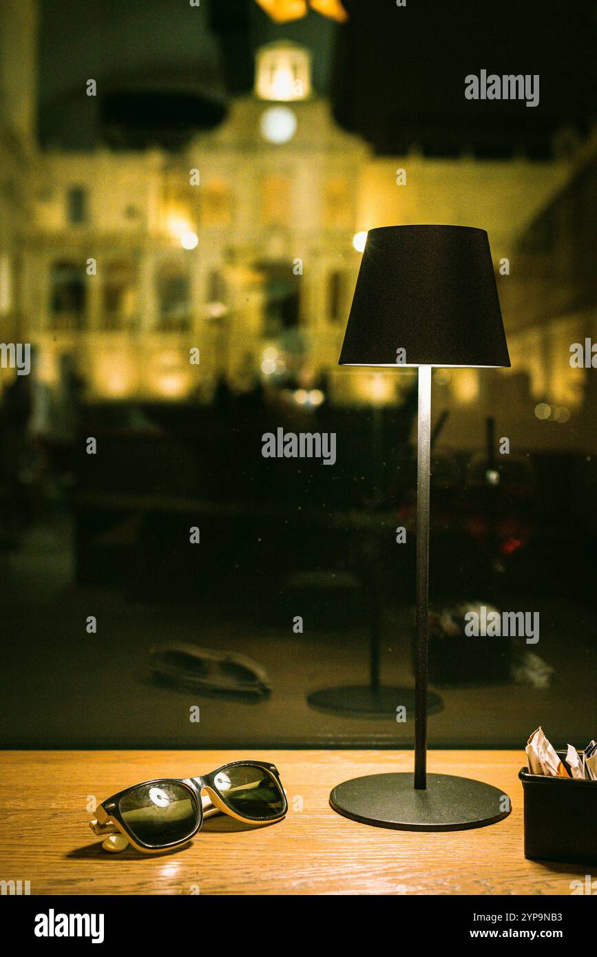Sunglasses, a lamp and a window on a beautiful square Stock Photo - Alamy