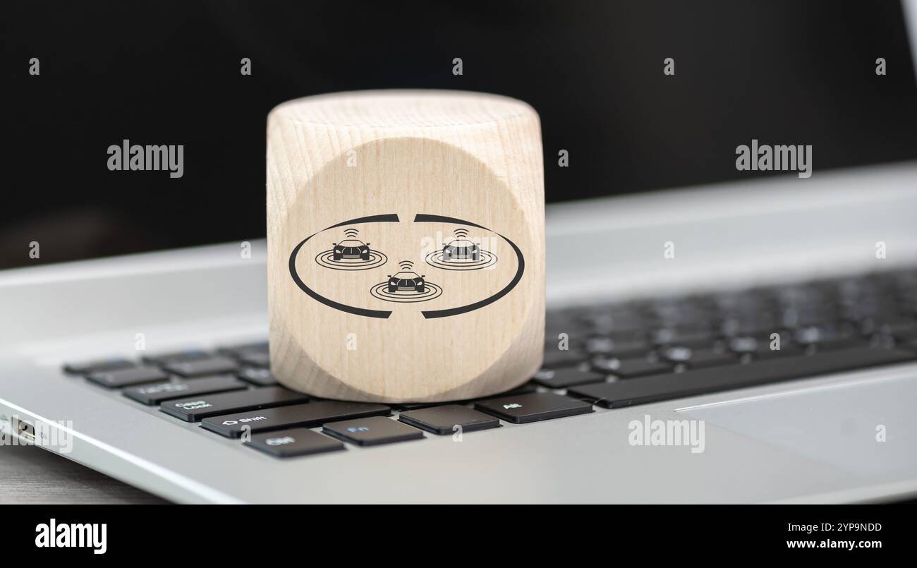 Wooden block with symbol of connected cars concept on laptop keyboard ...