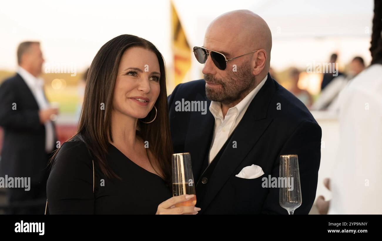 KRISTIN DAVIS and JOHN TRAVOLTA in CASH OUT (2024), directed by DOUG ...