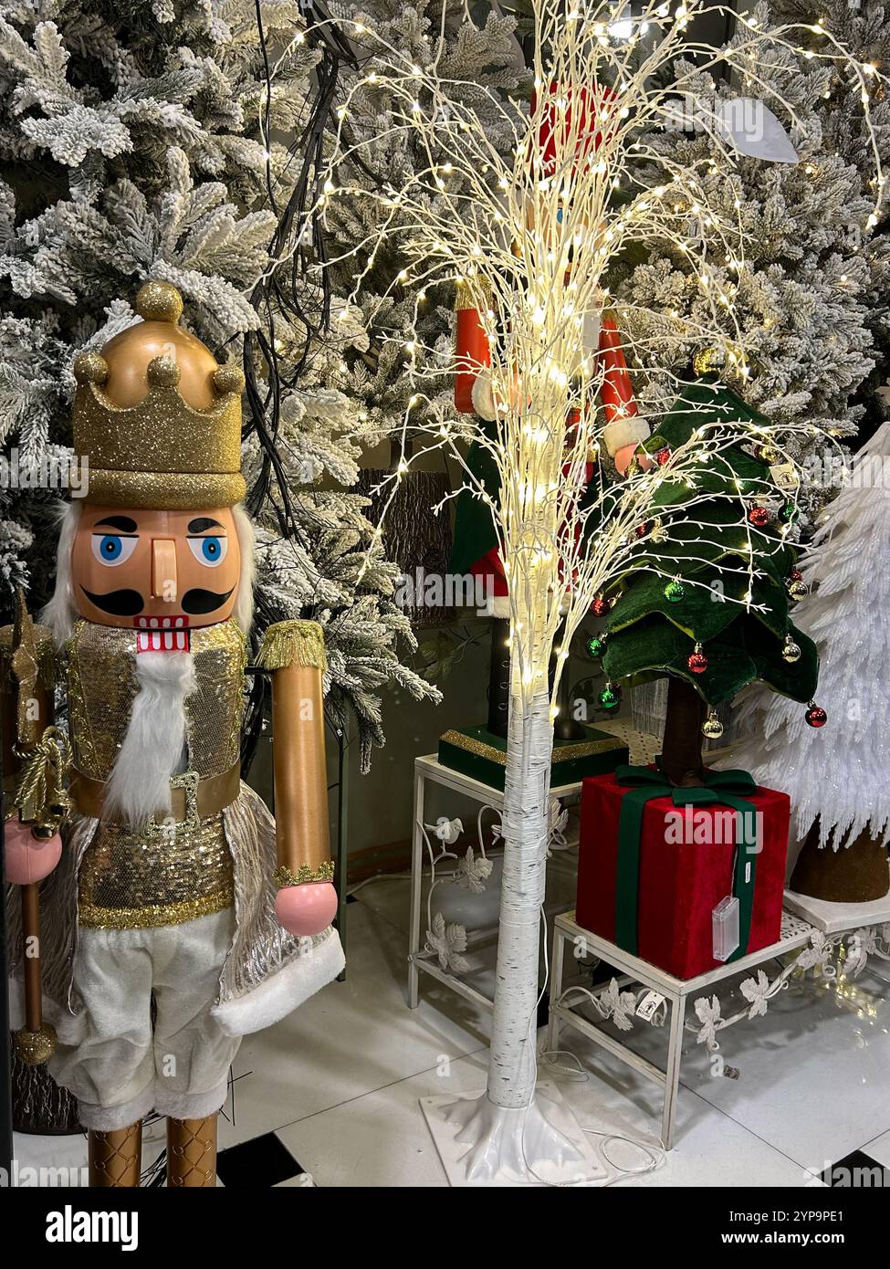 This vertical photo showcases a regal Nutcracker figure, adorned with ...