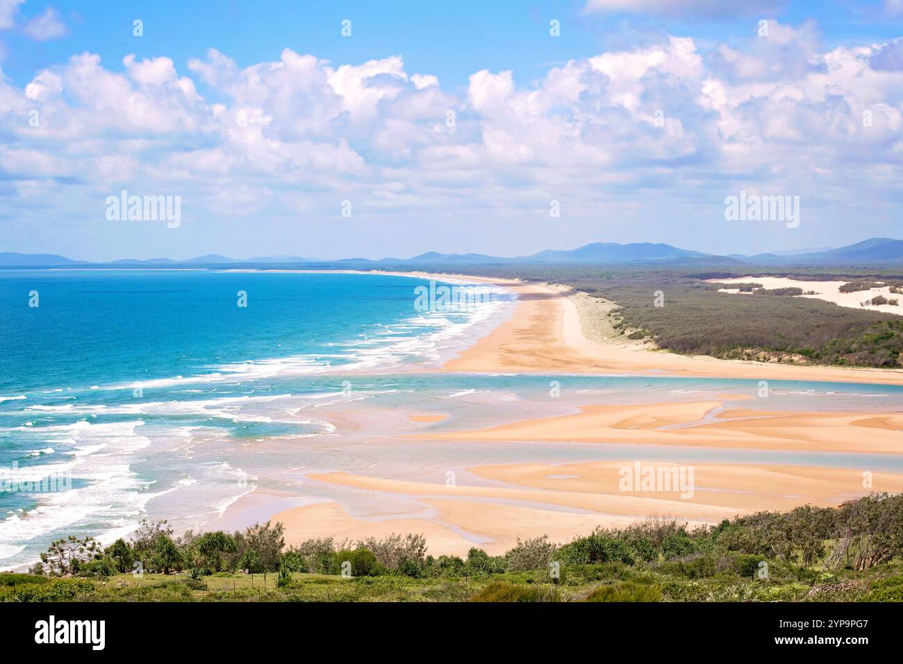 Bustard Bay beach, deserted long expanse, blue water and sky, discovery ...