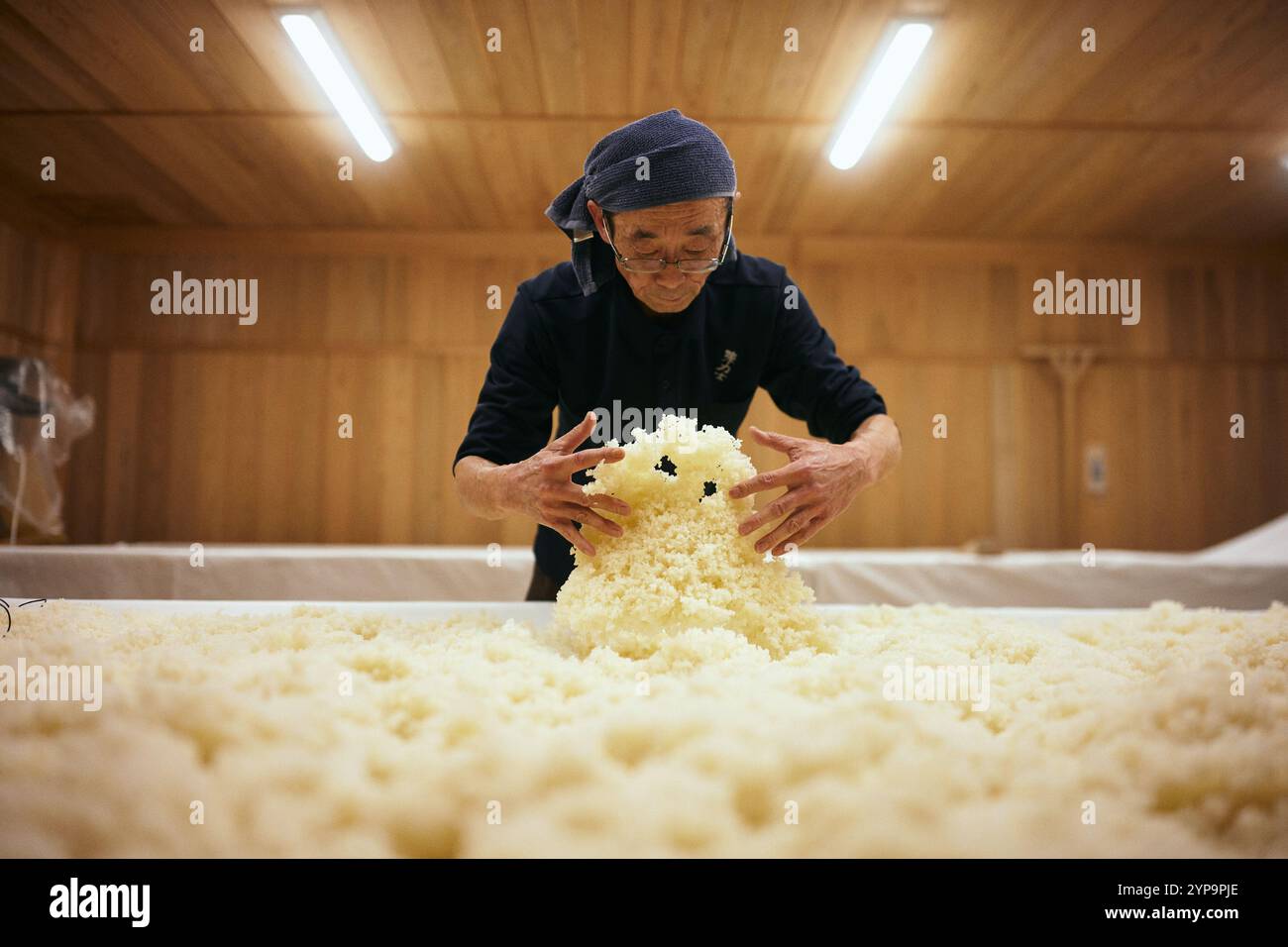 A picture shows a sake-brewing process at Shimazaki Sake Brewery in ...