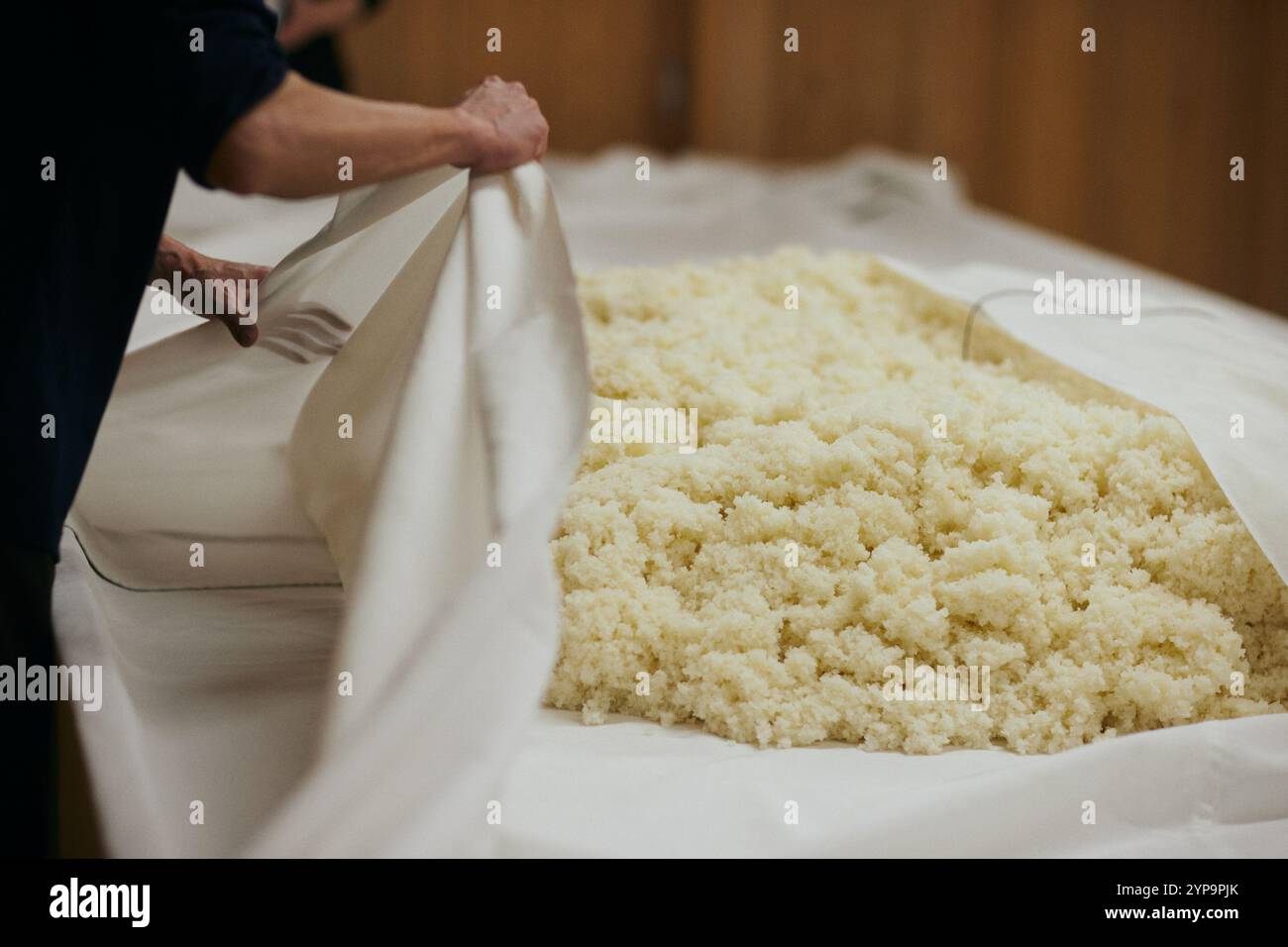 A picture shows a sake-brewing process at Shimazaki Sake Brewery in ...