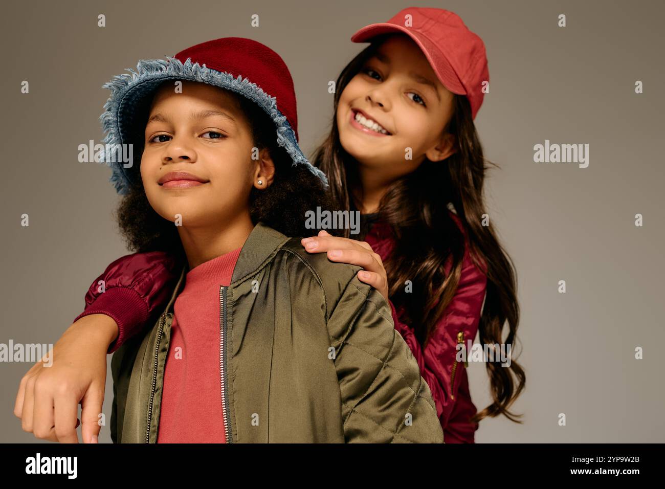 Two cheerful young girls pose together, embodying the joyful essence of ...
