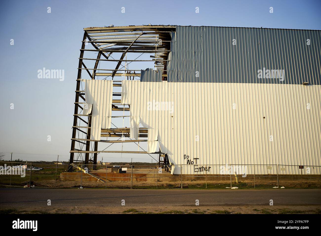 A large, partially collapsed warehouse from hurricane damage Stock ...