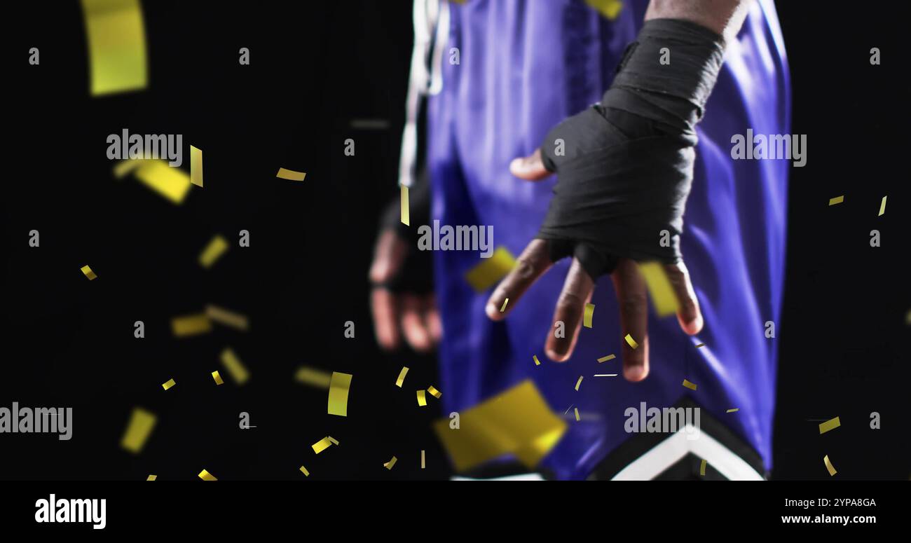 Image of confetti falling over african american male boxer on black ...