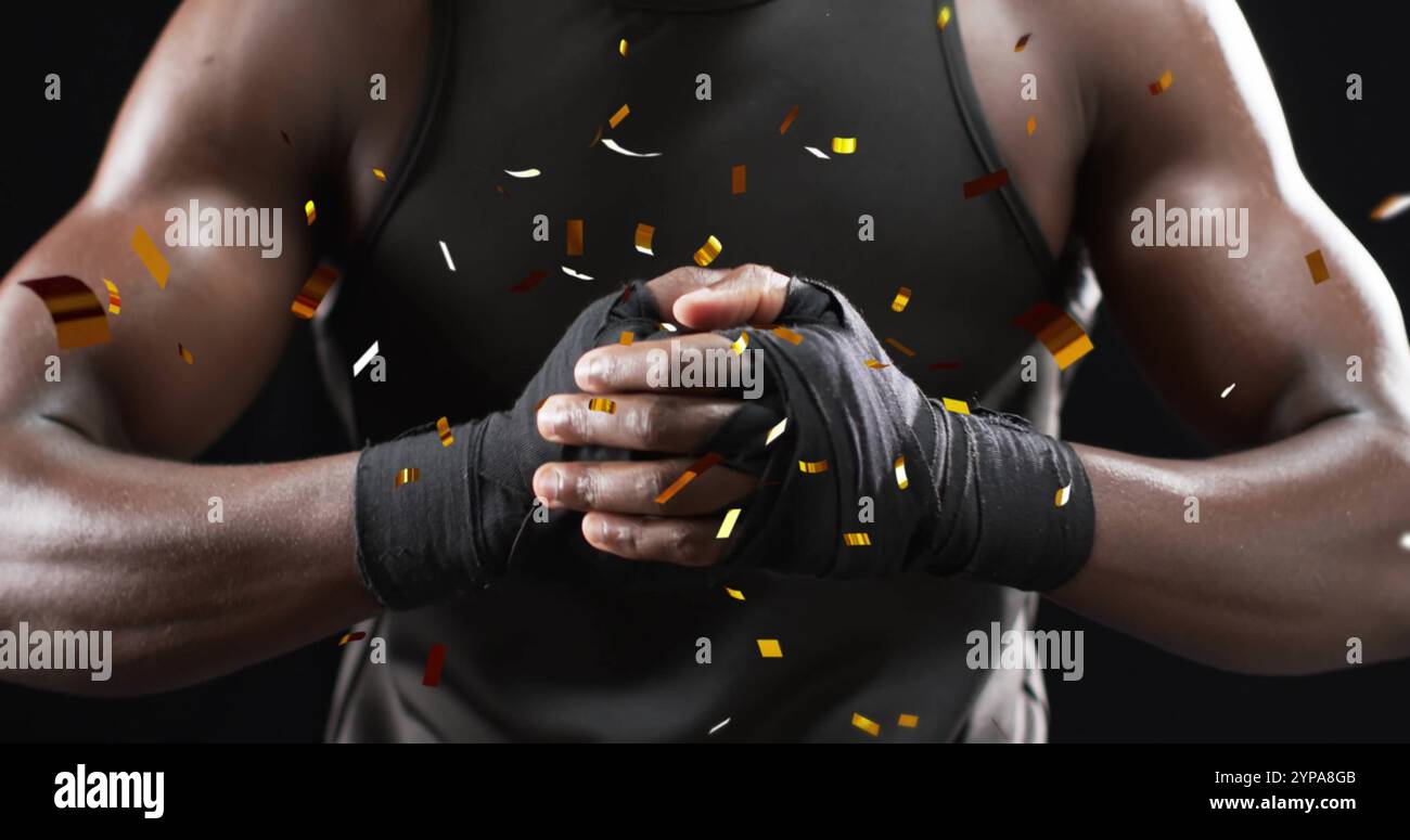 Image of confetti falling over african american male boxer on black ...