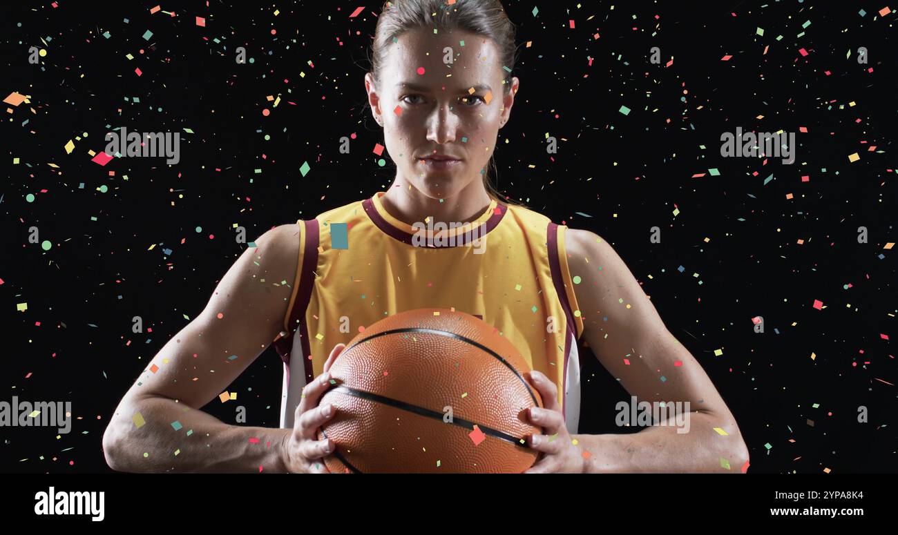 Image of confetti falling over caucasian female basketball player on ...