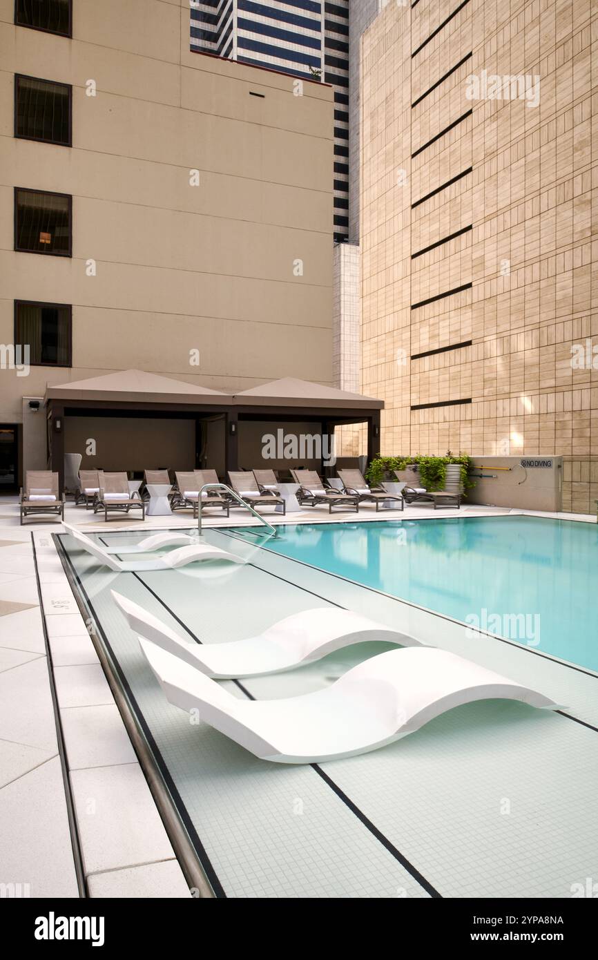 Serene outdoor pool area in a prominent city hotel Stock Photo - Alamy