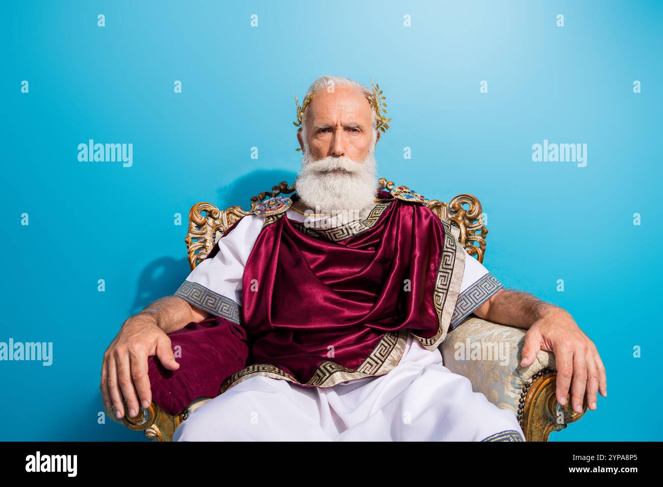 Photo of handsome senior male sit golden throne wear ancient greek god ...