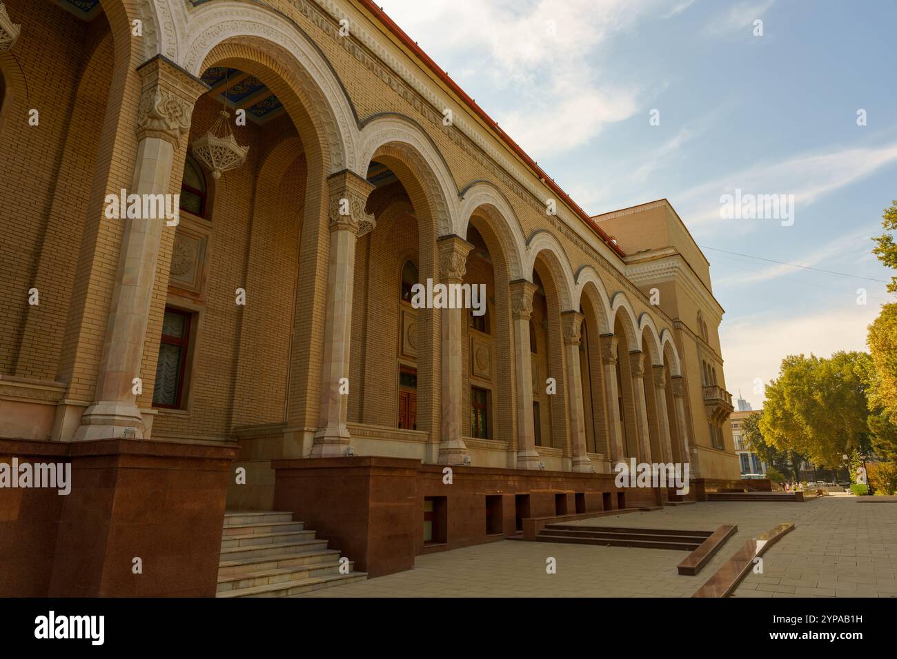 The building has arched windows and a large archway Stock Photo - Alamy