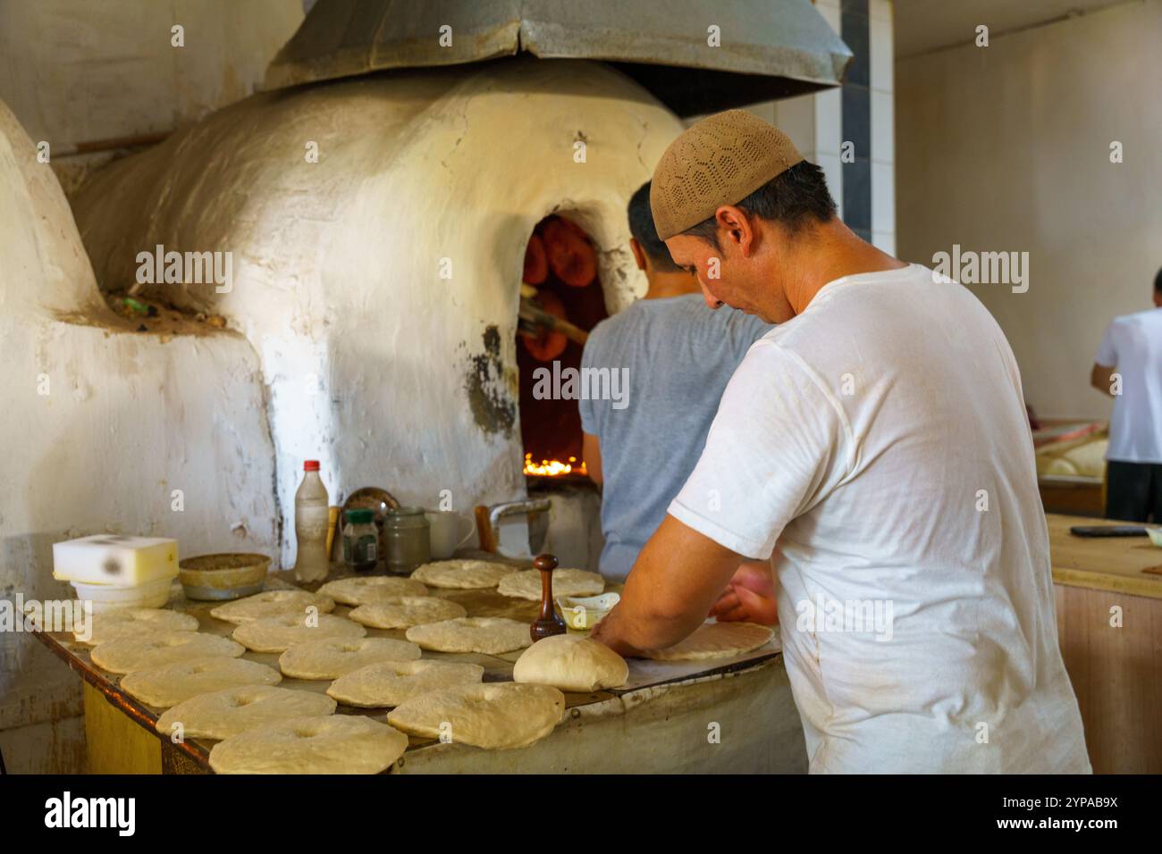 A man is making bread in a bakery Stock Photo - Alamy