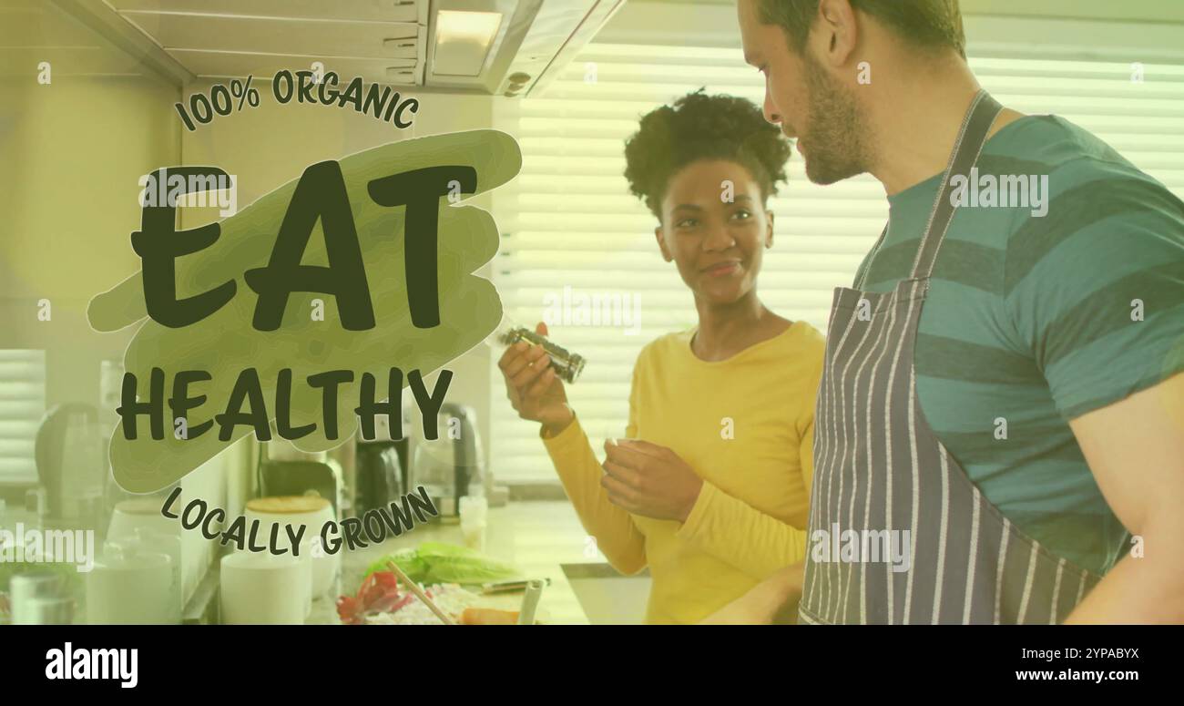 Image of eat healthy text over diverse couple preparing healthy meal in ...