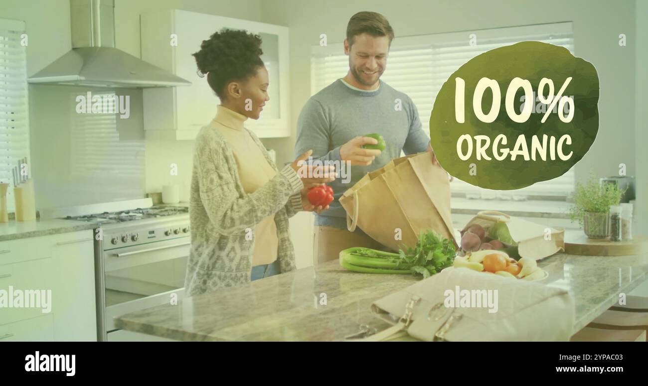 Image of 100 percent organic text over diverse couple preparing healthy ...