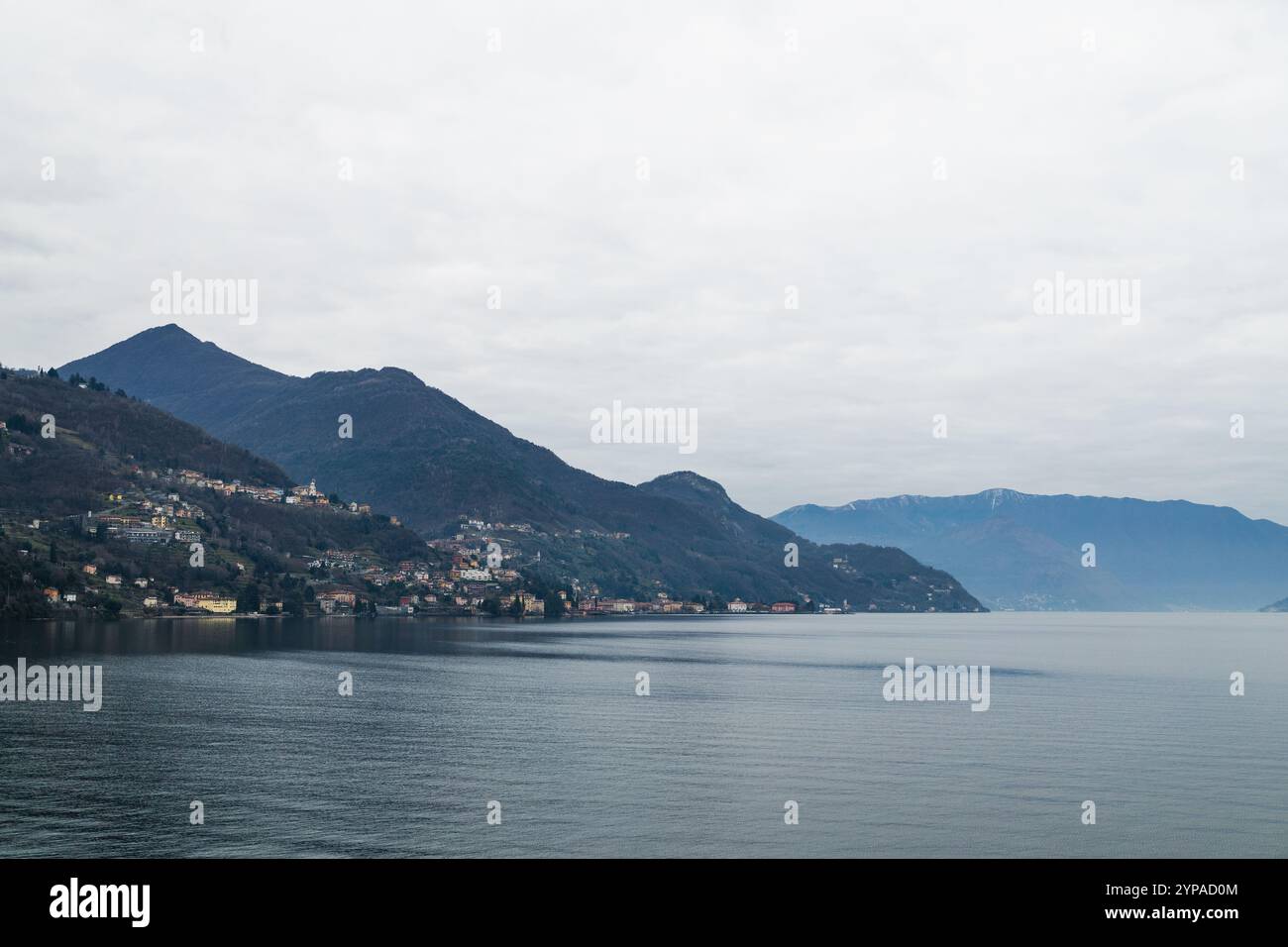 Cloudy sky above blue mountain vista, lake Como, Italy Stock Photo - Alamy