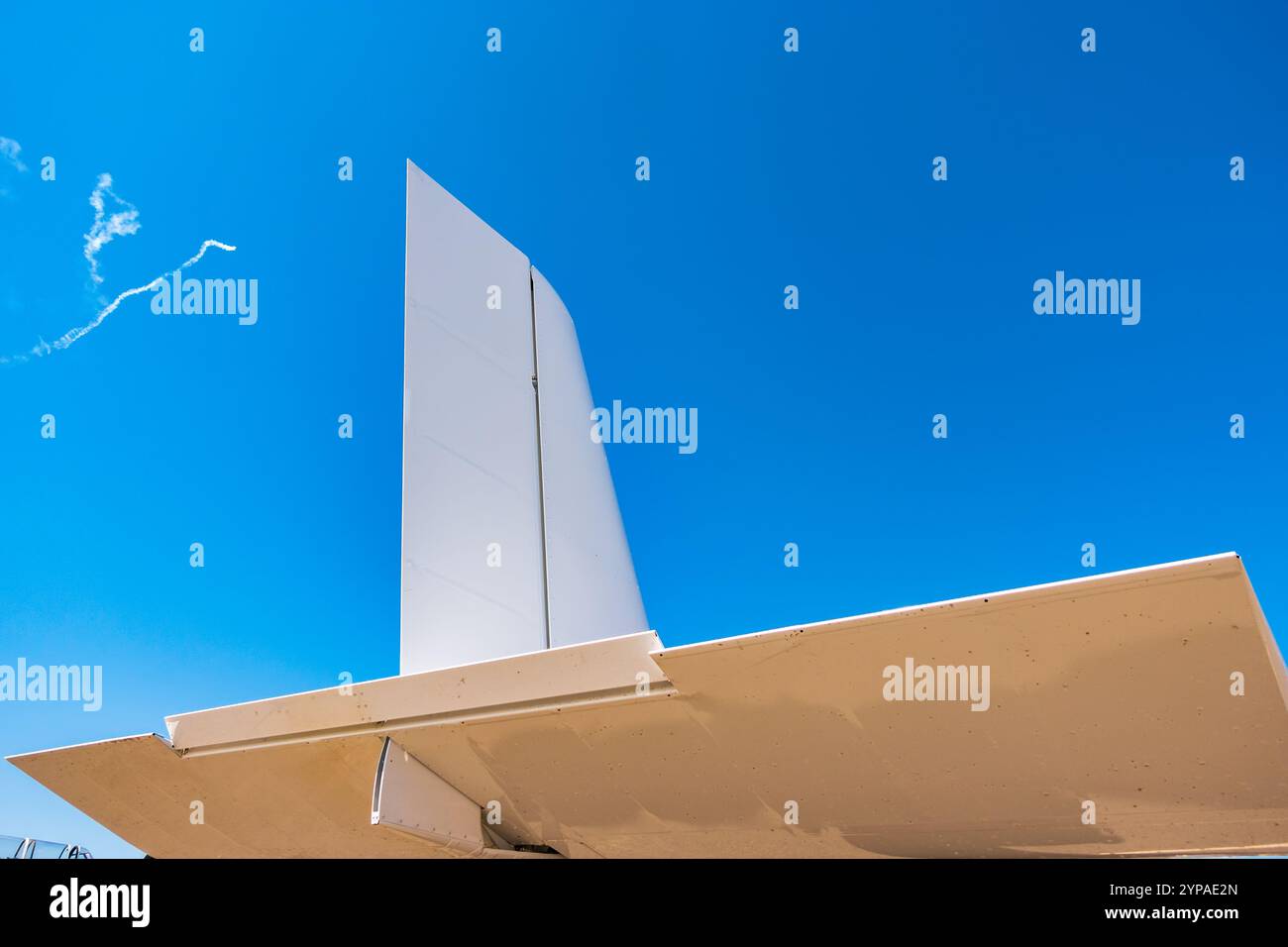 The back of the fuselage of a light-engine aircraft against the sky ...