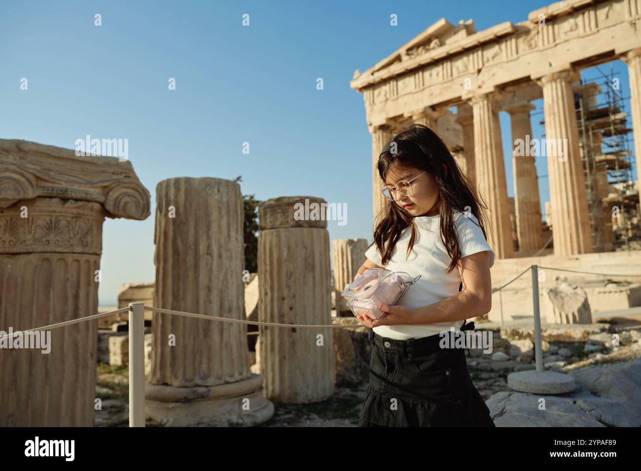 Girl is taking photos of the Parthenon at the Acropolis Stock Photo - Alamy