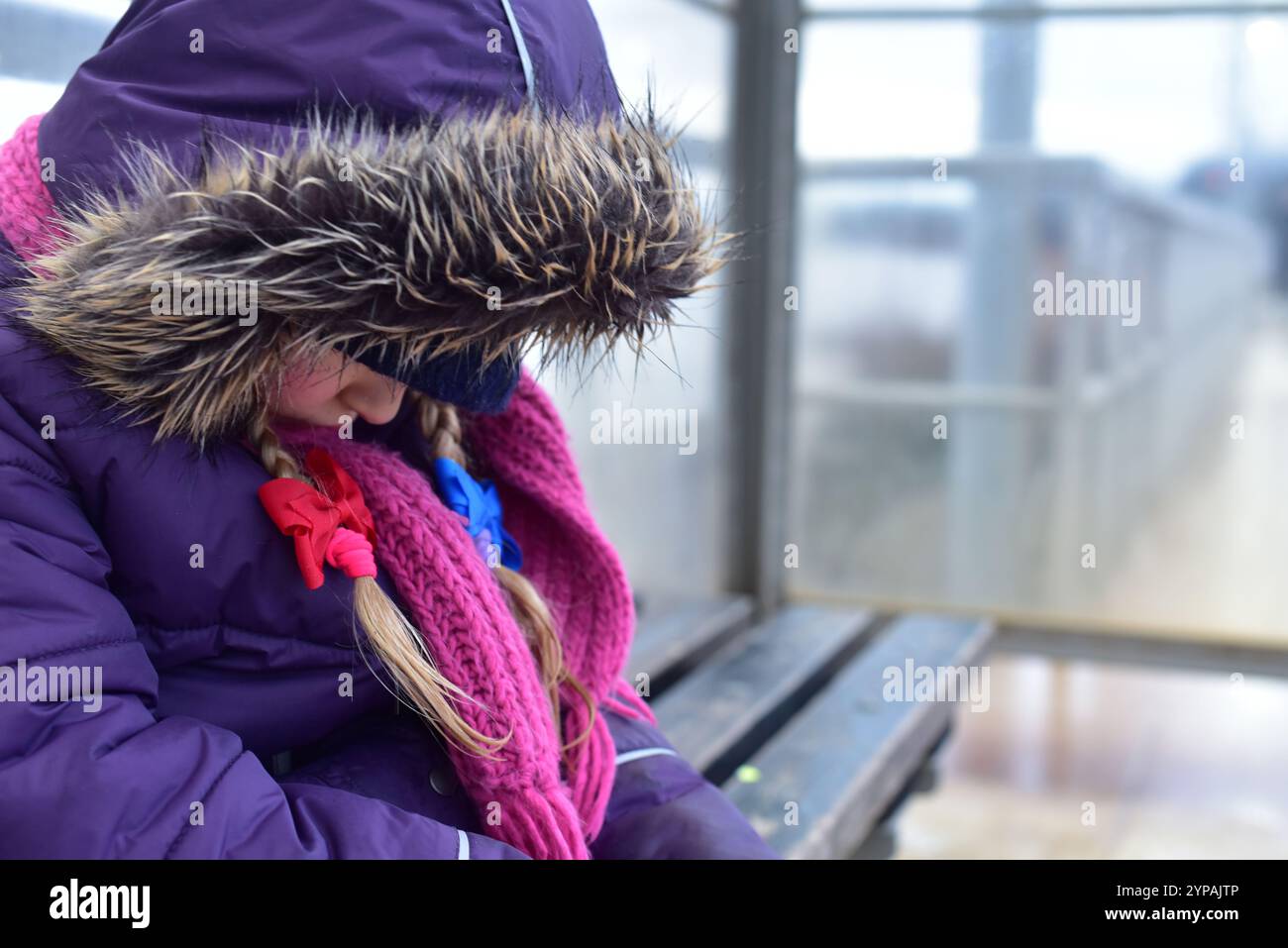 Little girl is sad and crying on a bench. Concept of bullying and ...