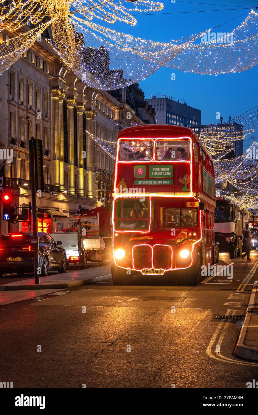 Decorated London bus in Regent Street showing Christmas lights London ...