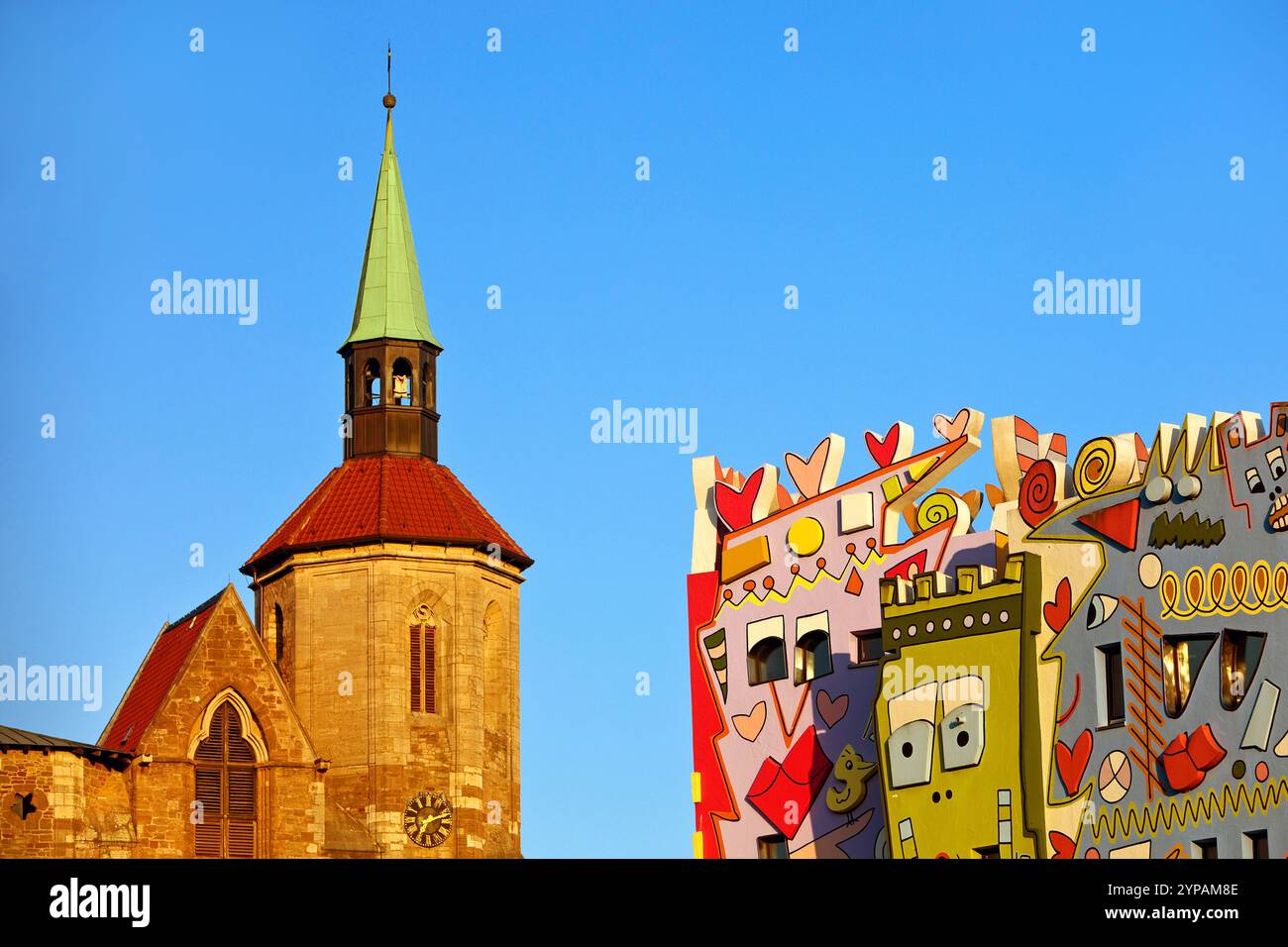 Magnikirche next to the Happy Rizzi House, residential building with ...