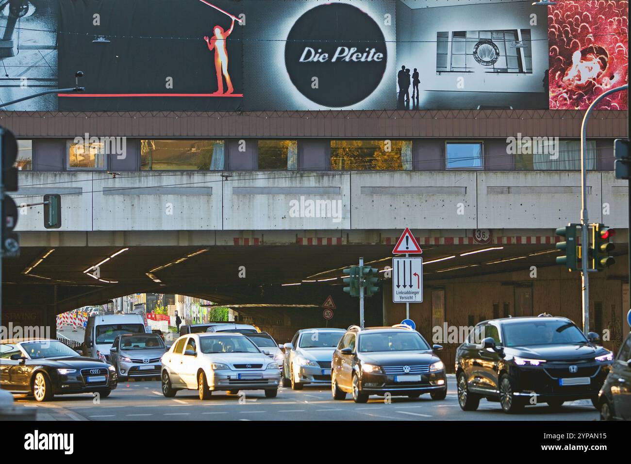 Textile banner with the words Die Pleite (insolvency) above the tunnel ...