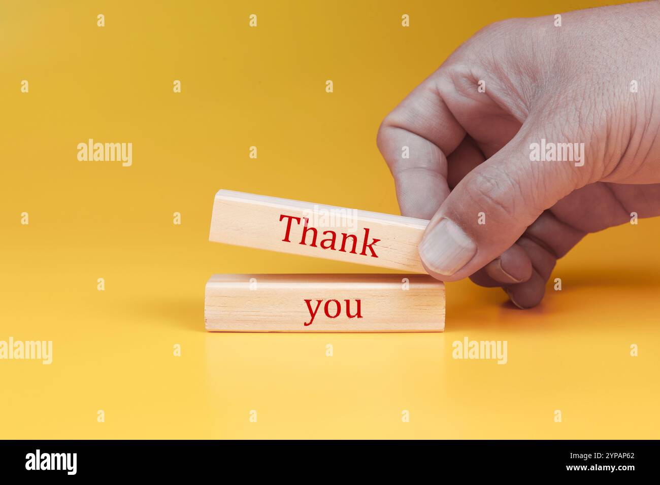 Thank you symbol. Wooden blocks with words Thank you. Beautiful yellow ...