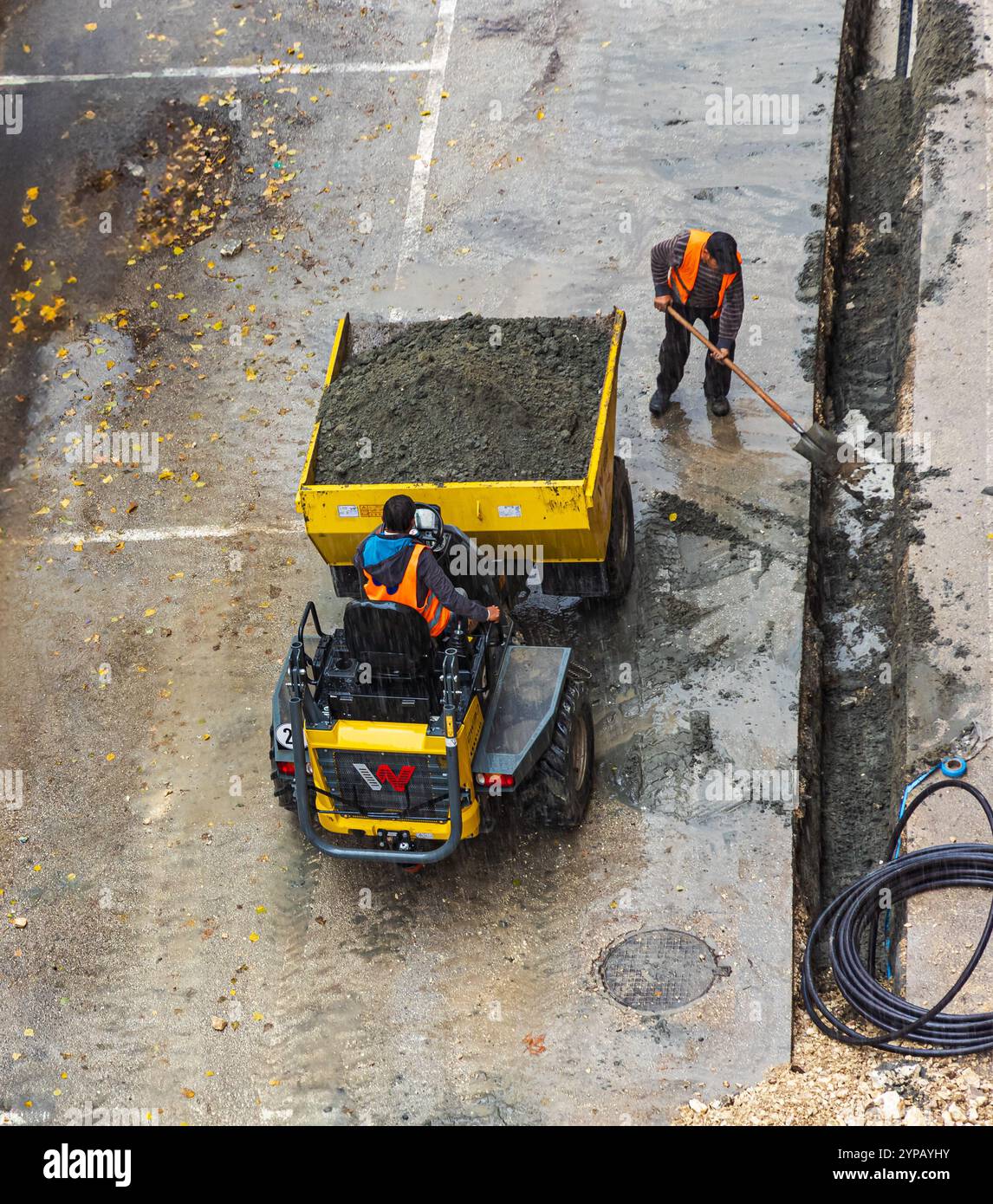 Man driving bulldozer or loader moves the earth at the construction ...