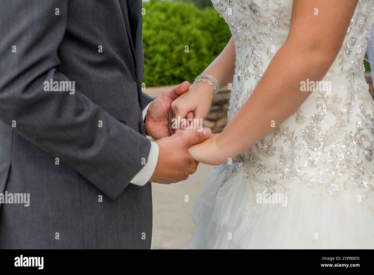 Bride and Groom Holding Hands Close-Up on Wedding Day – Elegant and ...