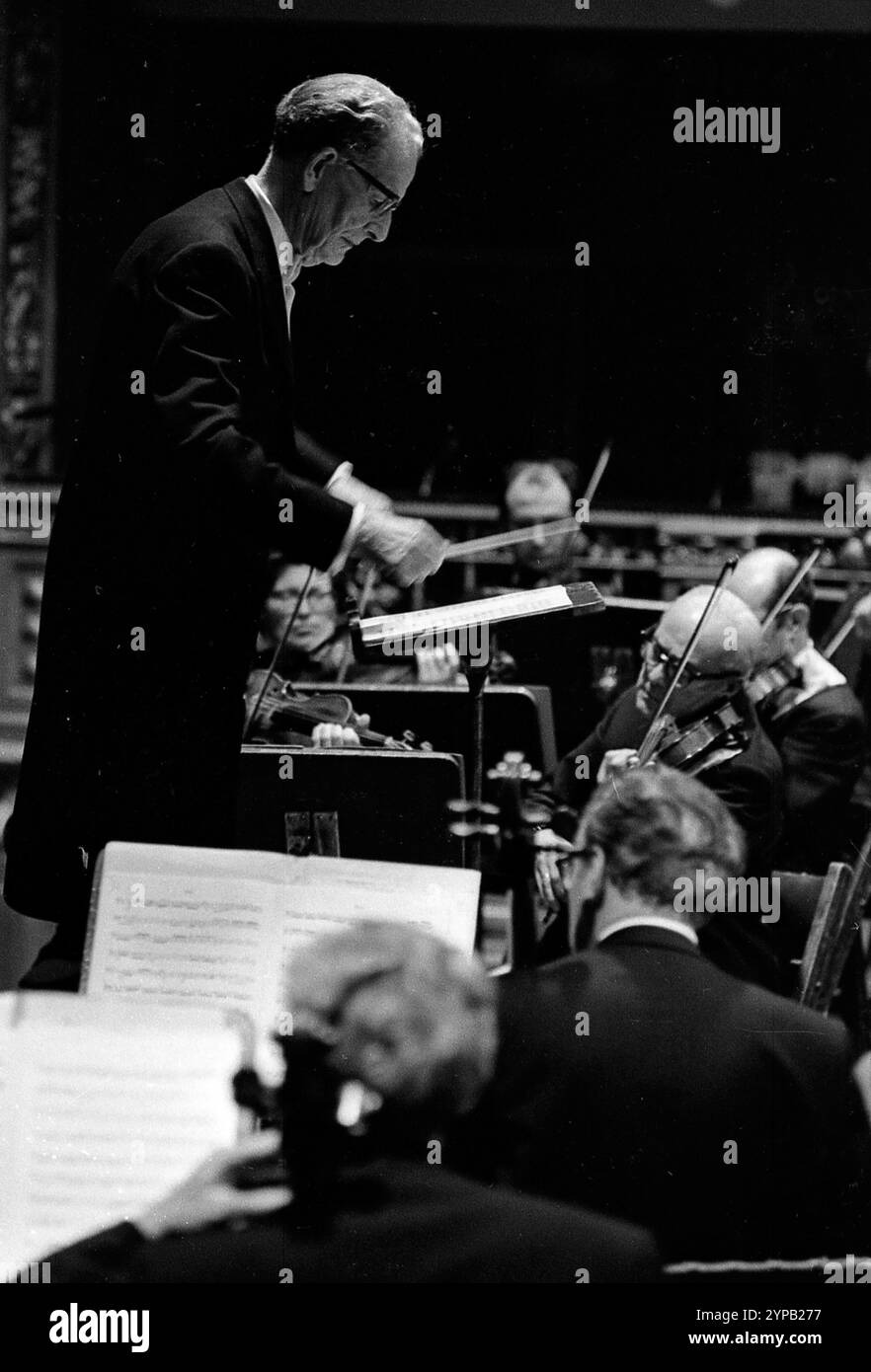 Swiss composer Frank Martin conducting an orchestra at the Teatro Odeón ...