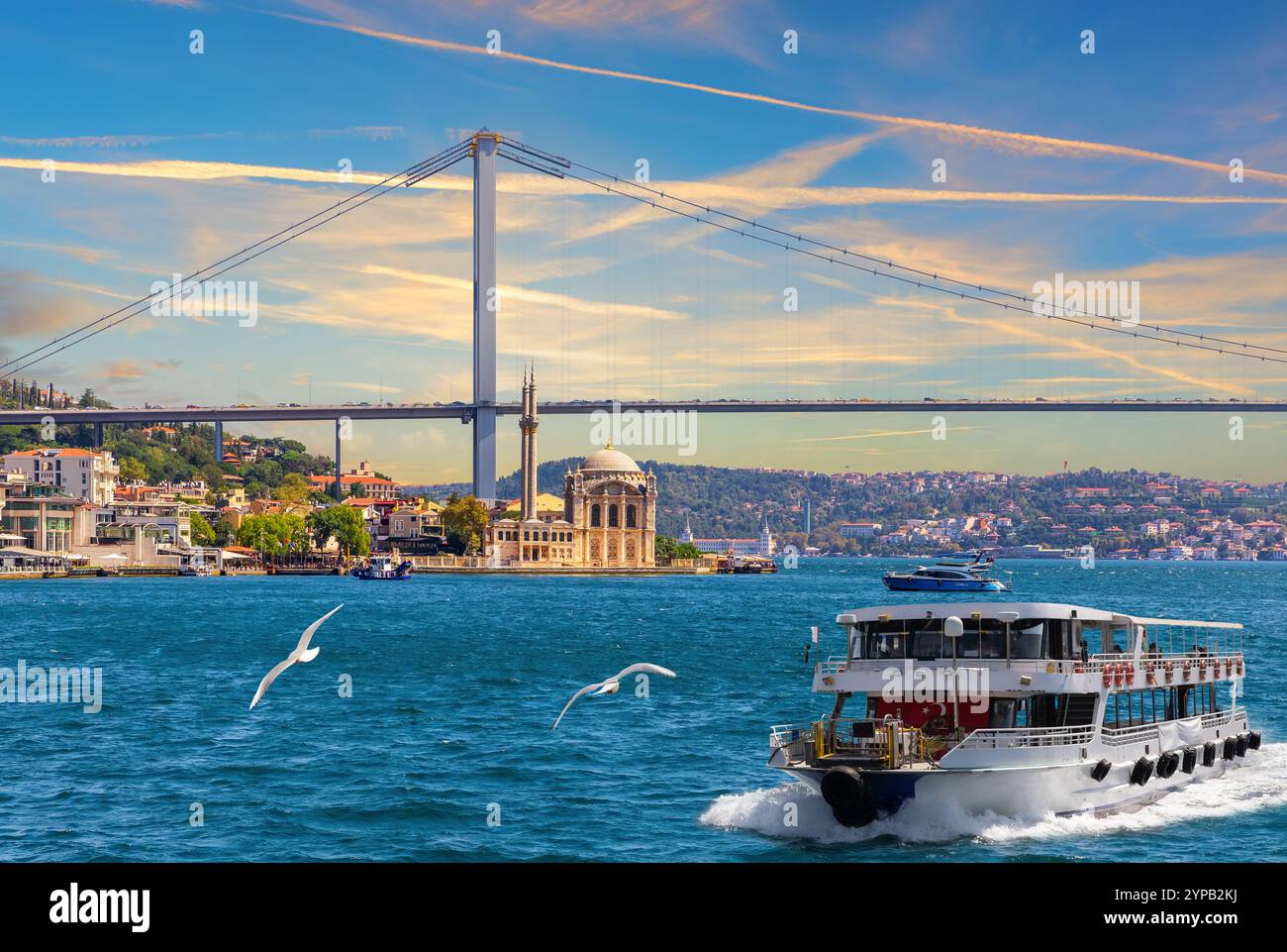 The cruise boat on the Bosphorus near the Grand Imperial Ortakoy Mosque ...