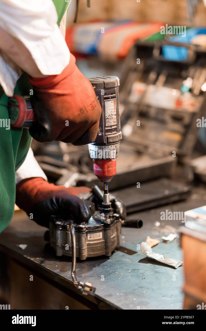 Precision Engineering: A Craftsman Using a Drill on Machinery ...