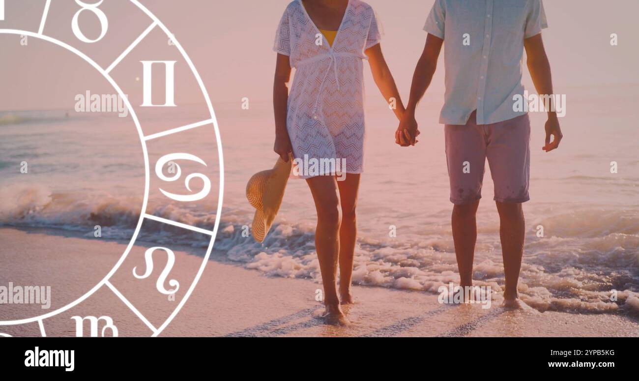 Image of horoscope over biracial couple holding hands at beach Stock ...