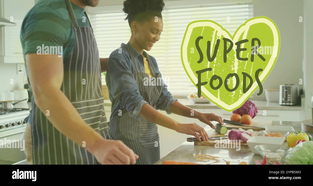 Image of super foods text over diverse couple preparing healthy meal in ...