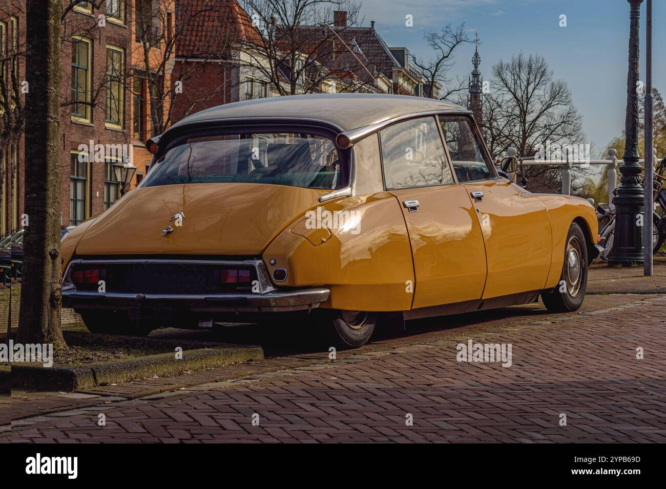 Yellow Citroen DS oldtimer on the street, seen from the back Stock ...