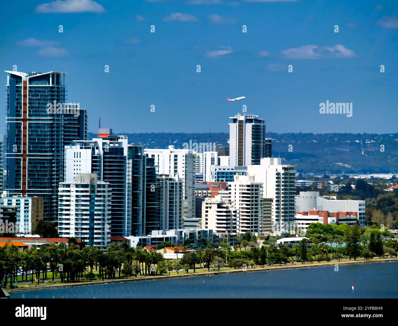 A Qantas airliner ascends into a Blue sky from Perth airport with the ...