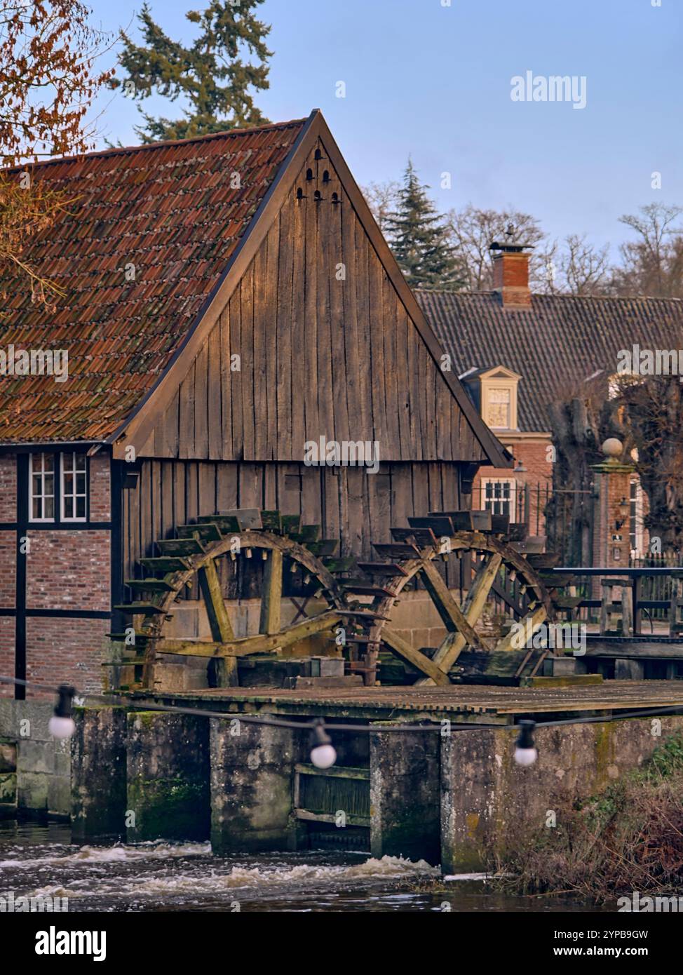 A beautifully preserved historic watermill in Lage, Germany, featuring ...