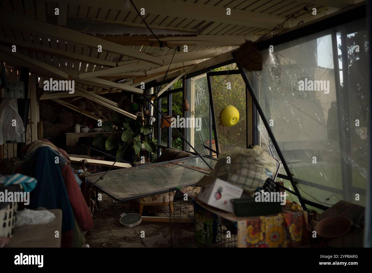 A damaged room of a house is seen in the Kibbutz Manara, which is ...