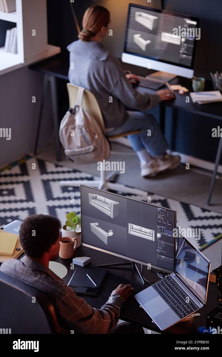 Two professionals working at desk, creating 3D architectural models on ...