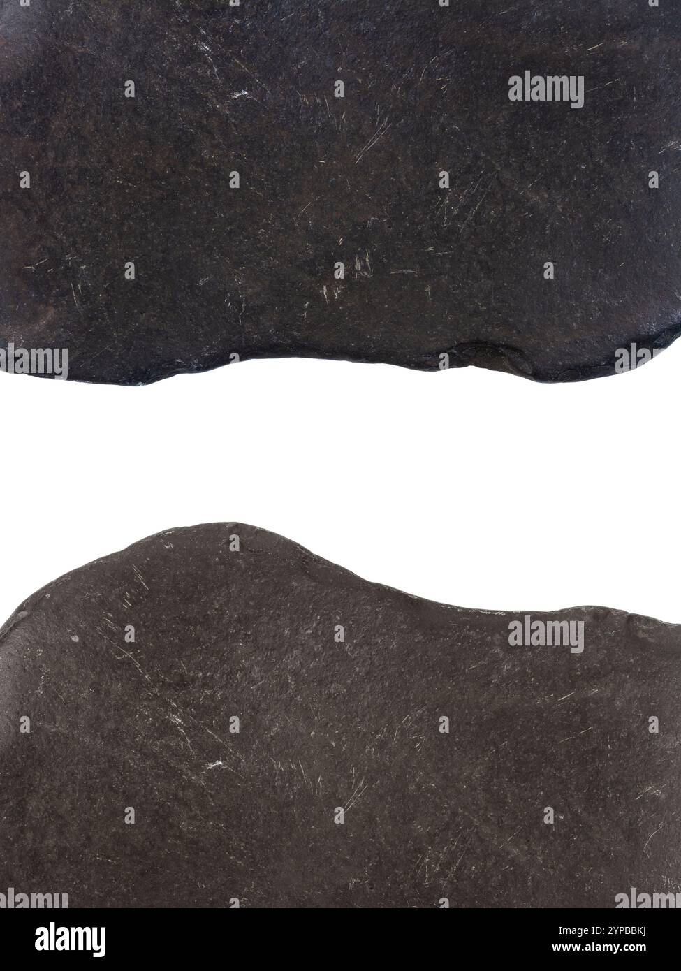 Edges of two pebbles isolated on white background with a space for text ...