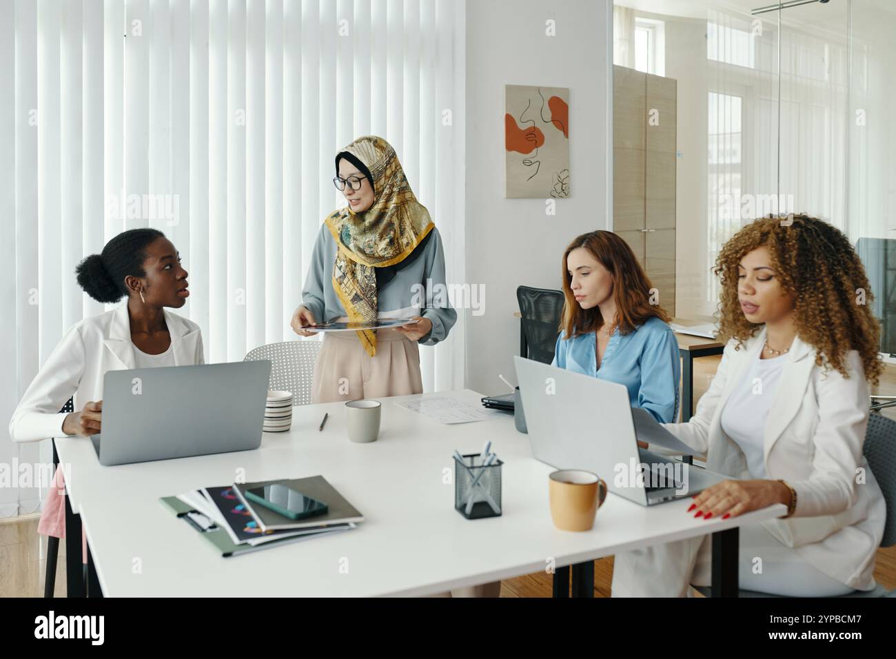 Conducting Business Meeting in Modern Office Setting Stock Photo - Alamy