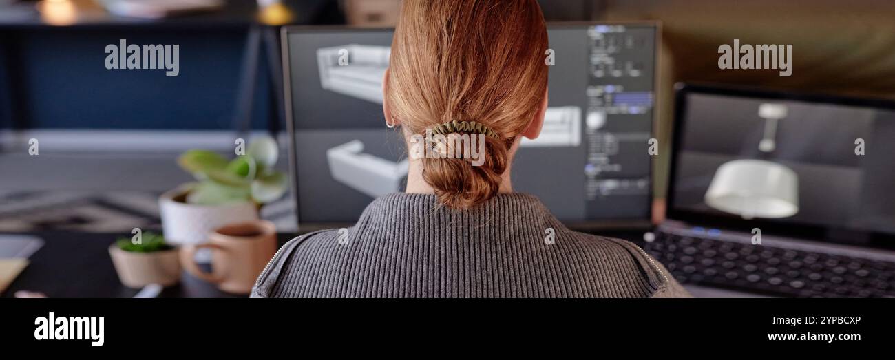 Person working on 3D modeling project shown from behind. Surroundings ...