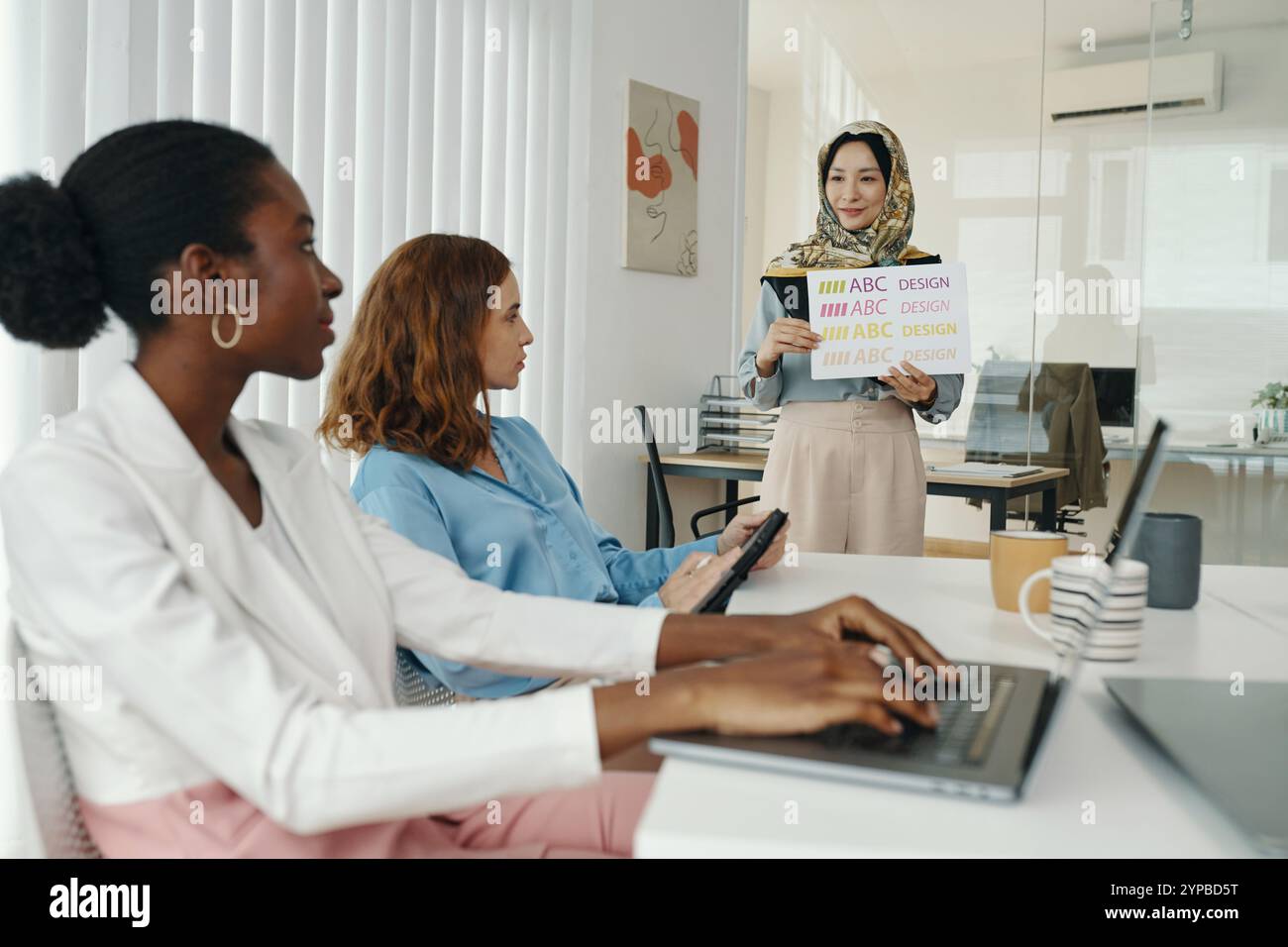 Discussing Design Concepts During Office Meeting Stock Photo - Alamy