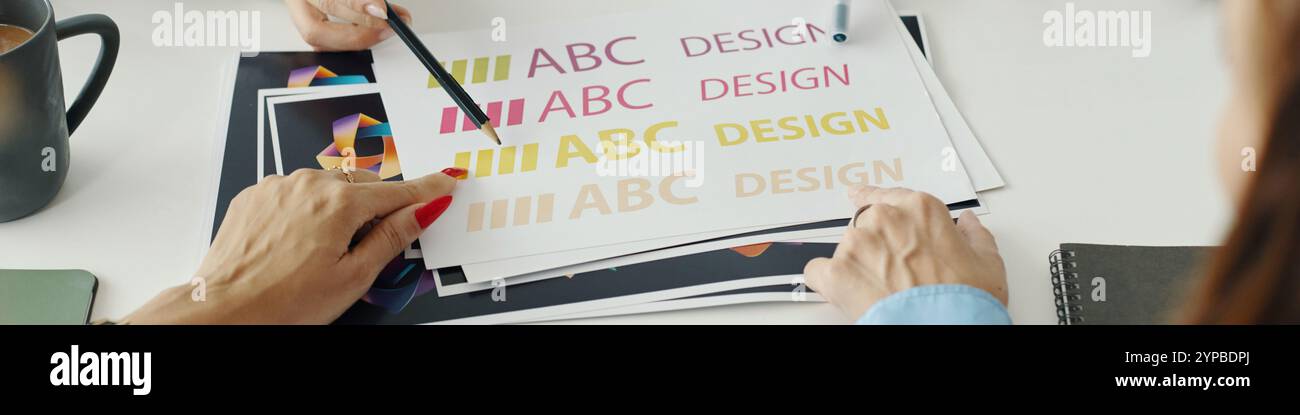 Discussing Design Concepts for a Graphic Design Project Stock Photo - Alamy