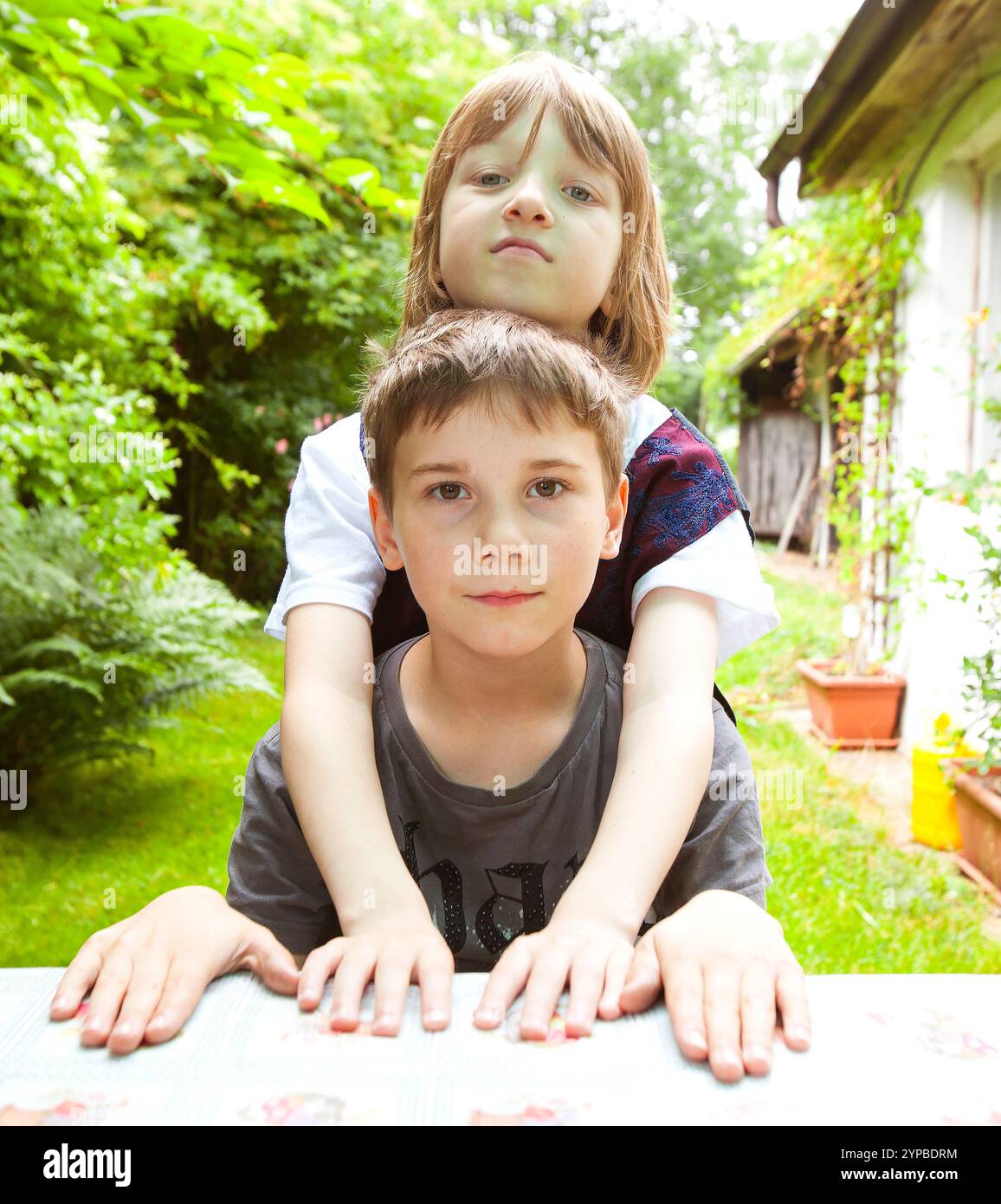 Two boys, both 9 years old, fooling around outdoors Stock Photo - Alamy
