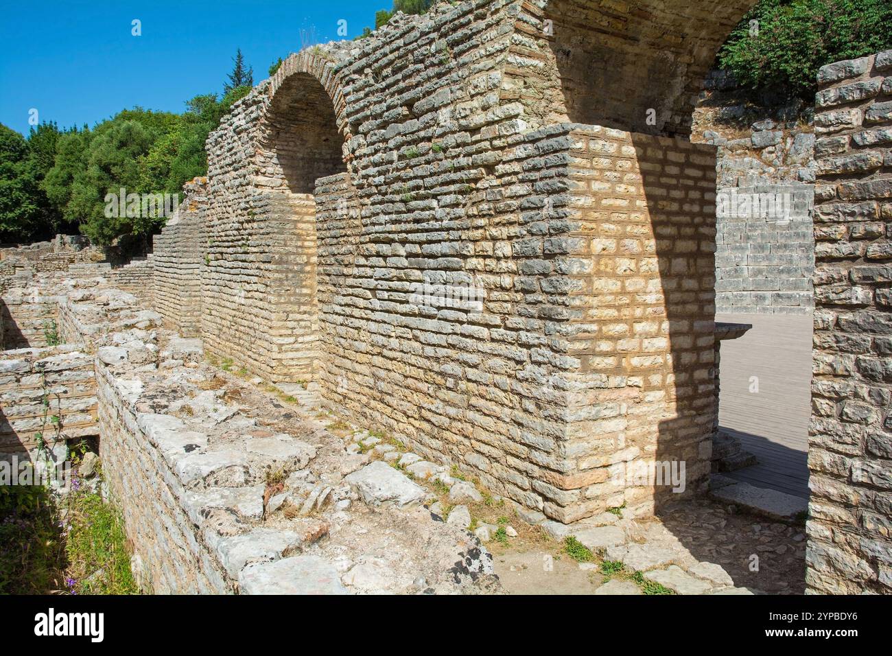The arched entrance to the 3rd century Roman Amphitheatre in Butrint ...