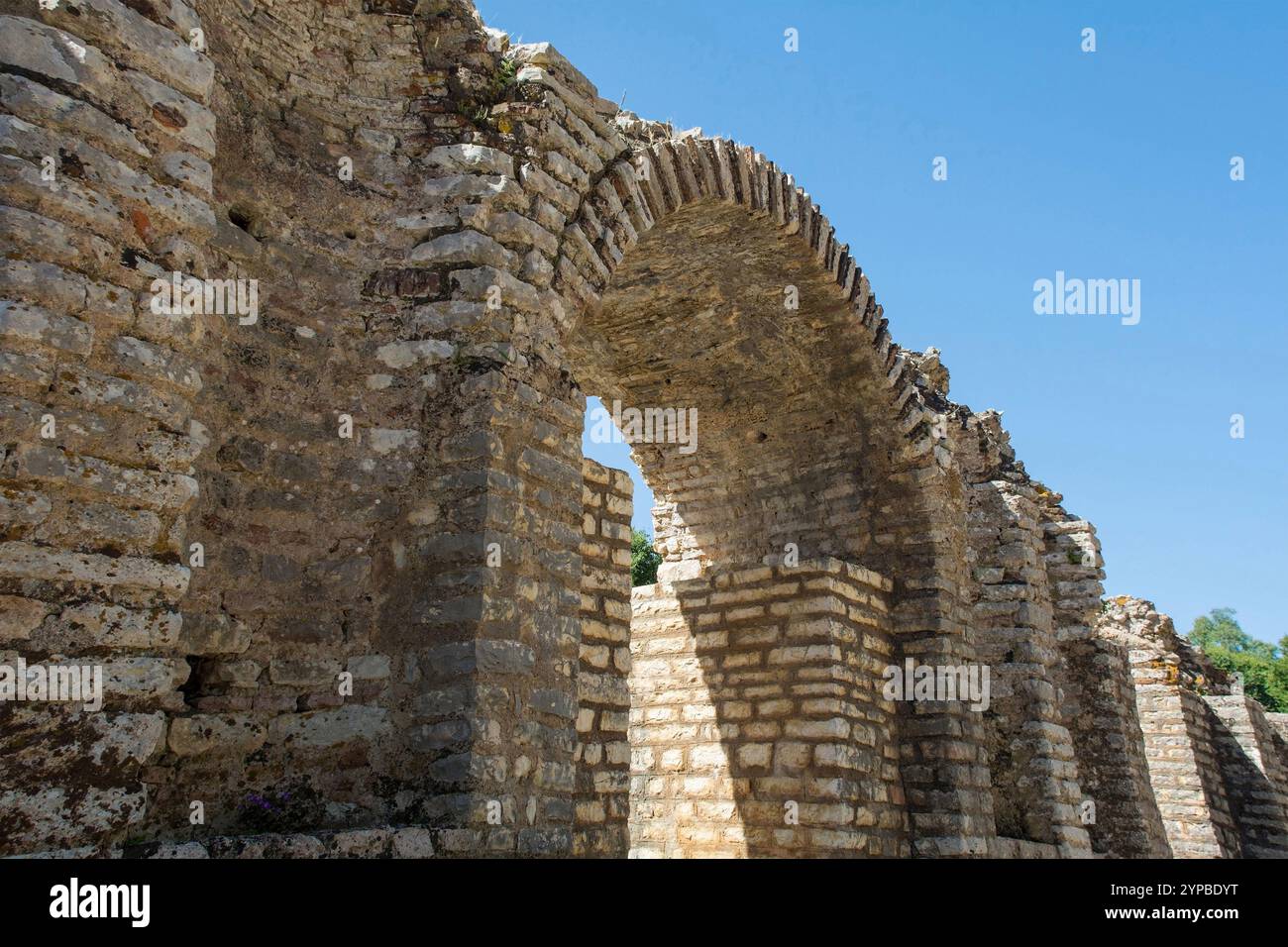 The arched entrance to the 3rd century Roman Amphitheatre in Butrint ...