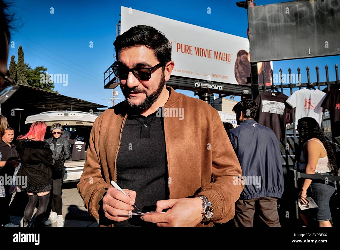 Actor Vache Tovmasyan signs an autograph for a fans during a ...